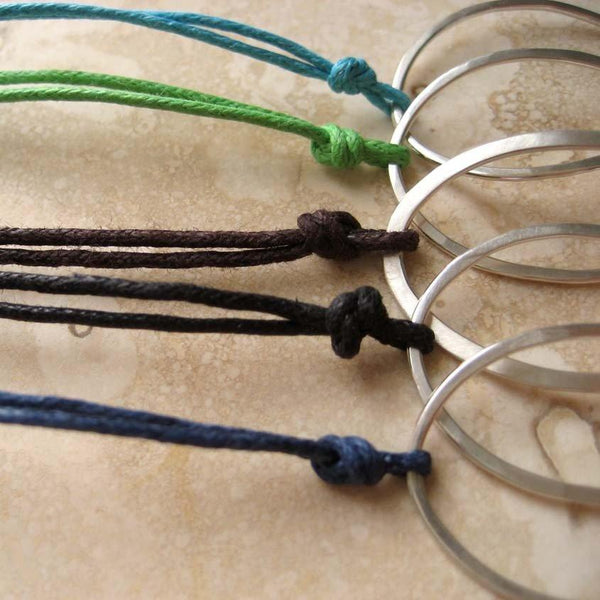 Pixie Bracelet - Hammered Metal Oval on Waxed Cotton Cord - Rebecca ...